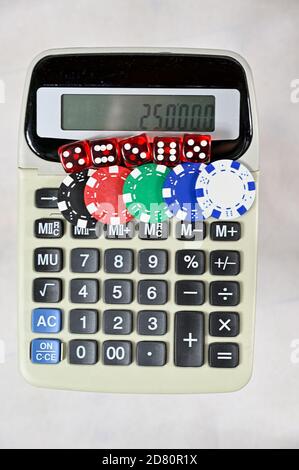 dice and chips on old calculator on white background Stock Photo - Alamy