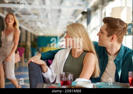 Say hello to summer. a man sitting outdoors while holding his digital ...
