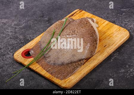 Raw stingray wings tasty fillet for cooking Stock Photo - Alamy