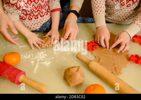 Dough and christmas cookie. Children making christmas cookies in the ...