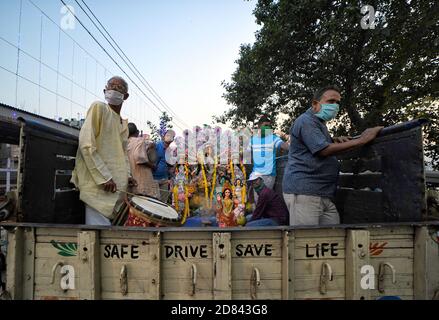 Kolkata, India. 26th Oct, 2020. Hindu devotees immerse Durga Idol in ...