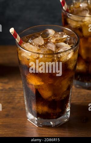 Cold Refreshing Dark Cola with Ice Cubes, Straws on a gray surface, low angle view Stock Photo ...