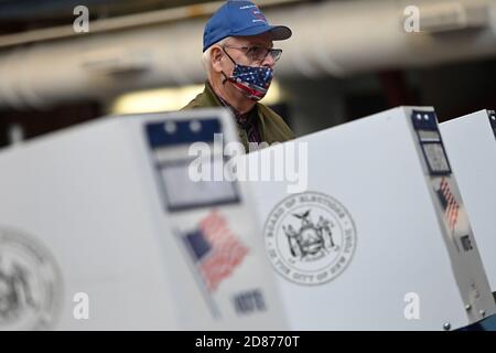 A voter steps from a booth after casting a ballot in the New Hampshire ...