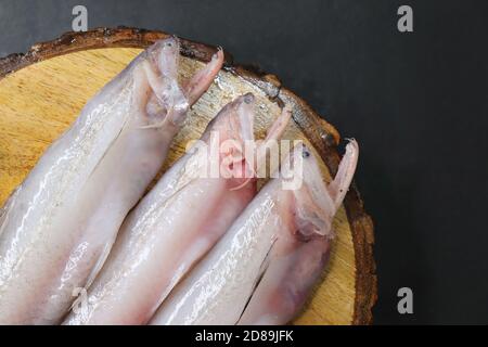 Fresh sea fish Bombay duck or Bombil and ingredients for cooking, green ...