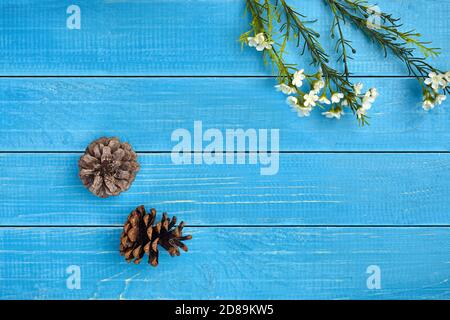 A bunch of artificial flowers, two white stickers, and craft paper ...