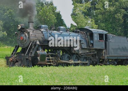 Close Up of an Antique Steam Passenger Train Puffing Along Stock Photo ...