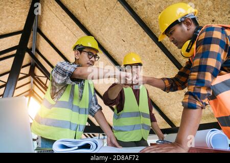 A team of successful and professional Asian engineer or architect in ...
