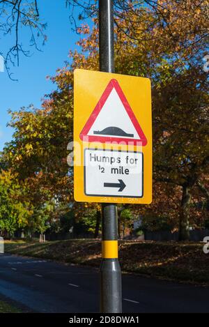 Road sign warning of humps for half a mile as part of a traffic calming ...