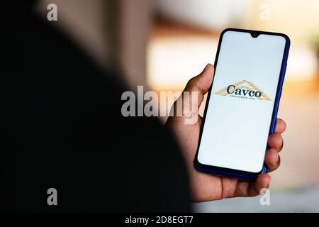 In this photo illustration, the Cavco Industries logo is seen displayed ...