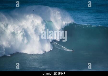 Justine Dupont from France rides a wave during a tow surfing session at ...