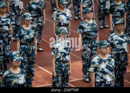 Over 7000 freshmen of Central China Normal University wear camouflage T ...