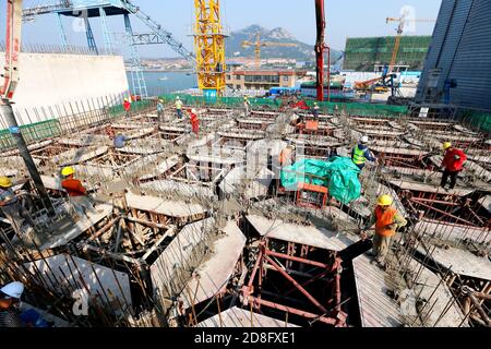 Aerial view of Qingdao Port undergoing expansion in Qingdao city, east ...
