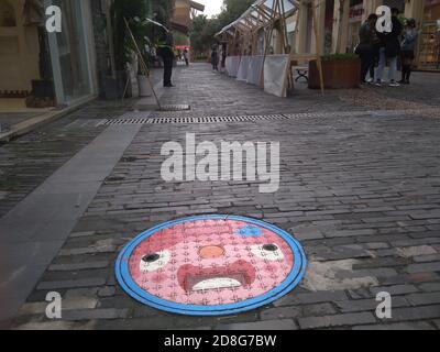 View of the manhole covers with cartoon paintings at Chengxi Street ...