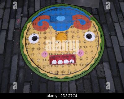 View of the manhole covers with cartoon paintings at Chengxi Street ...