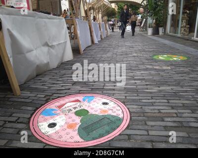 View of the manhole covers with cartoon paintings at Chengxi Street ...