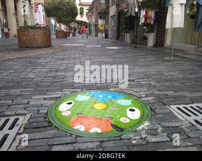 View of the manhole covers with cartoon paintings at Chengxi Street ...