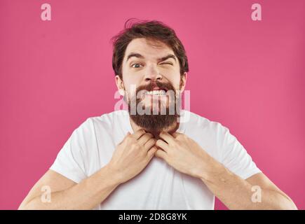 Angry man yells on pink background stress irritability model Stock ...