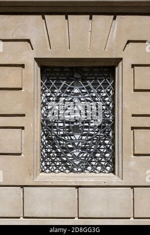 Iron bars of the old house. It has ornaments with red hearts and fake ...