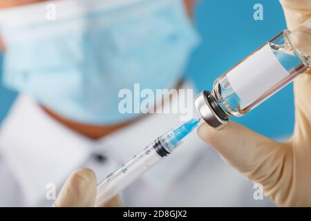 Nurse takes an ampoule of medicine from the manipulation table Stock ...