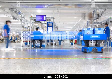 Models of Alibaba's IFashion brands cat walk on the runway set up at ...