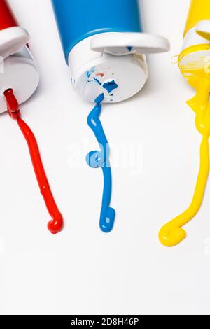 Colorful paint tubes squeezed on white sheet of glass Stock Photo - Alamy
