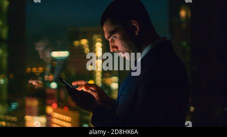 A person types on a cellphone in Ottawa on, Dec. 15, 2025. THE CANADIAN ...