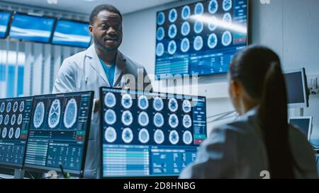 Two Medical Scientists in the Brain Research Laboratory Discussing ...