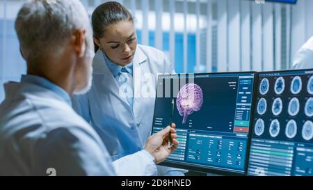 Two Medical Scientists in the Brain Research Laboratory Discussing ...