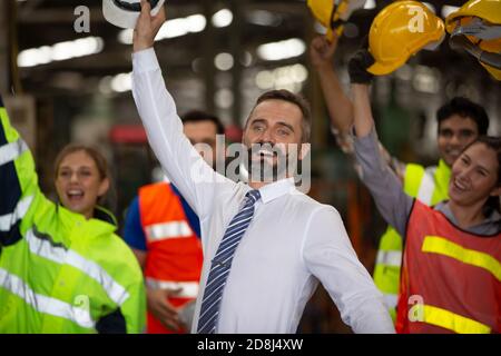 Engineer working with workers working as a team against the backdrop of ...