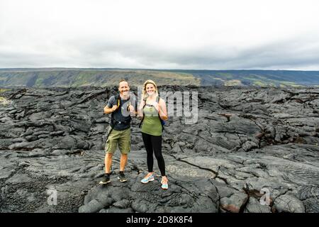 The couple Tourist visiting the lava field at hawaii Stock Photo - Alamy