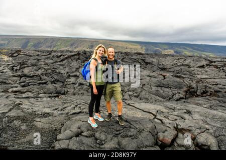 The couple Tourist visiting the lava field at hawaii Stock Photo - Alamy