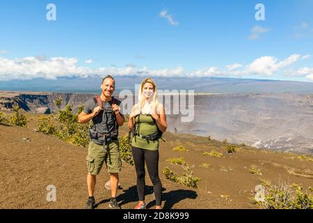 The Hiking couple seeing volcano national park from crater on the ...