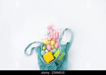 bag with sprinkled Easter eggs on a white background. Background for ...