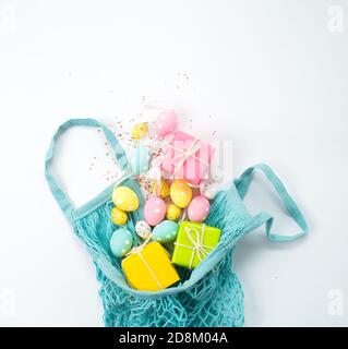 bag with sprinkled Easter eggs on a white background. Background for ...