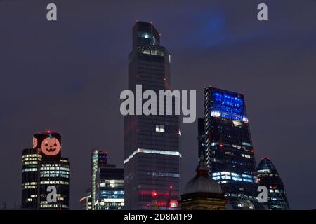 A pumpkin is illuminated onto the tower 42 skyscraper, London Stock ...