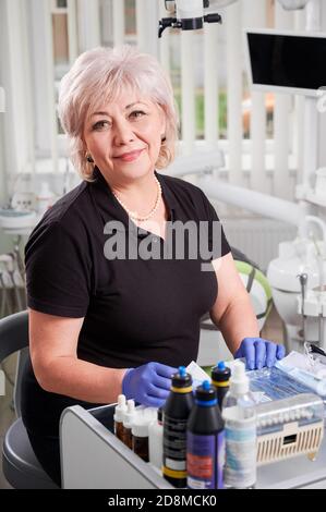 Senior woman sitting at doctor appointment doing ok gesture shocked ...