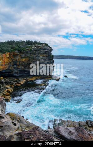 Jagged Rocky Cliffs facing the Sea Stock Photo - Alamy