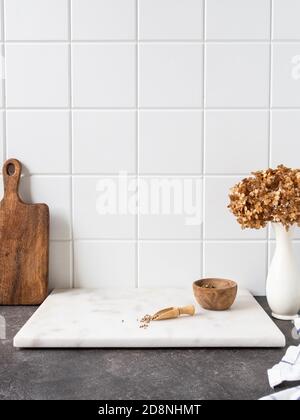 front view of the kitchen marble countertop with cans of coffee and a ...