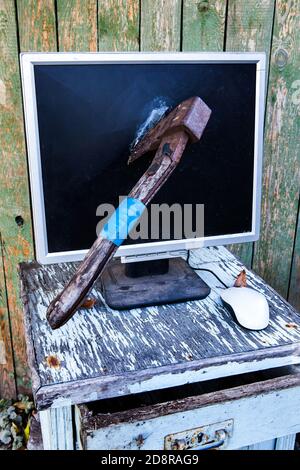 Axe to Smash a Computer Screen on the Grass Background with a Keyboard ...