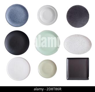 Set of clean color plates on table Stock Photo - Alamy