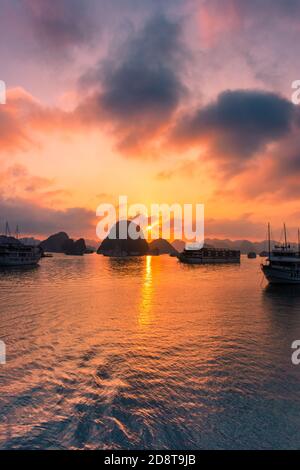 Amazing sunset over Ha Long Bay, Vietnam Stock Photo - Alamy