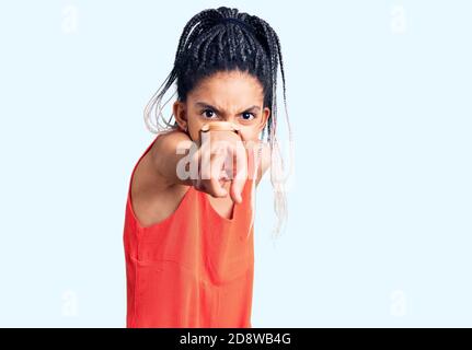 Unhappy girl pointing finger to camera in disagreement Stock Photo - Alamy