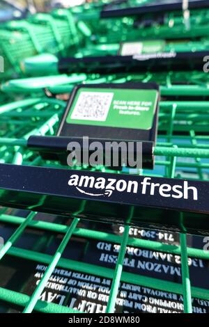 Amazon fresh sign on shopping carts in the parking lot at their new ...