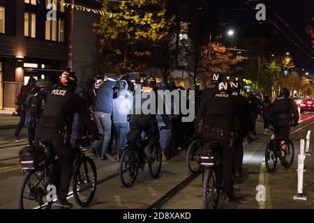 Seattle, USA. 31st Oct, 2020. Police pushing protestors at the ...