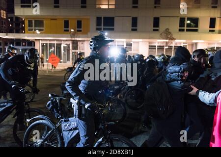 Seattle, USA. 31st Oct, 2020. Police pushing protestors at the ...