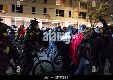 Seattle, USA. 31st Oct, 2020. Police pushing protestors at the ...