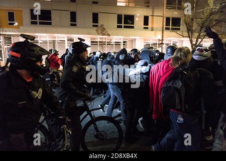 Seattle, USA. 31st Oct, 2020. Police pushing protestors at the ...