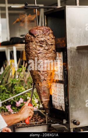 Mexican food Trompo Pastor tacos al pastor, beef stacked in sauce with ...