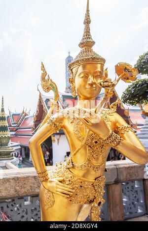 Elegant golden statue of Kinnari at Grand Palace, Bangkok, Thailand ...