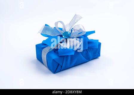 Classic blue surprise gift box with blue and white ribbon, background ...